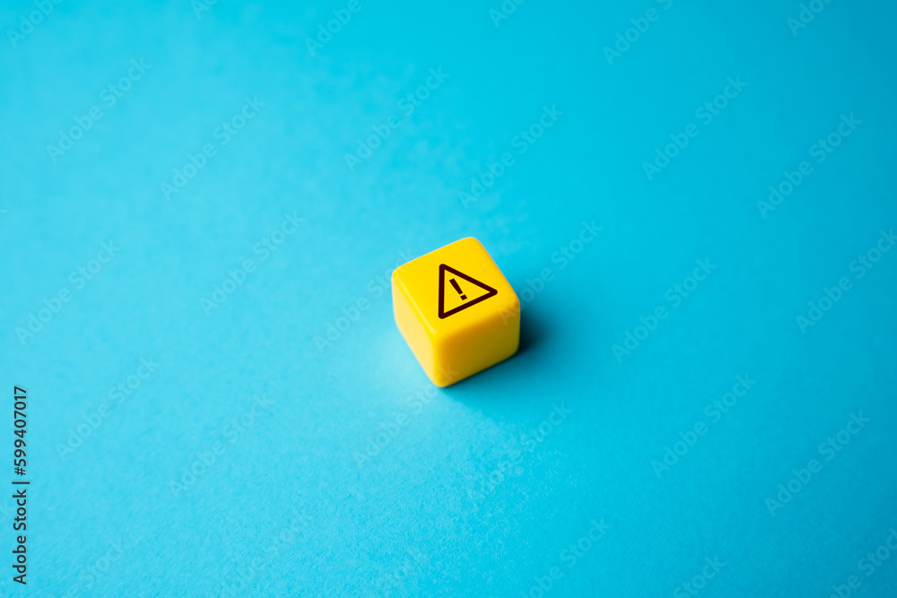 Warning sign on yellow block. Stress, problems. Something wrong. Danger ...