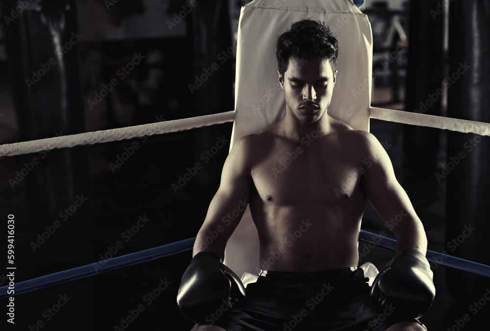 Hes found his place in the boxing ring. Portrait of a young male boxer ...