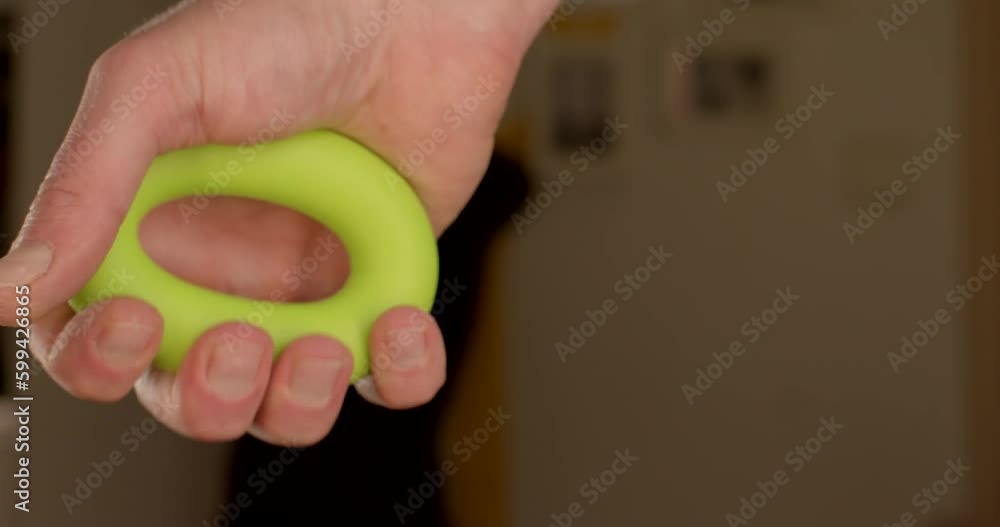 The tone of a man's strength. Squeezing and unclenching the hand in the ...