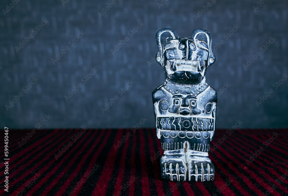 Statuette, Andean Puma, Puma Punku. Isolated on dark background and ...