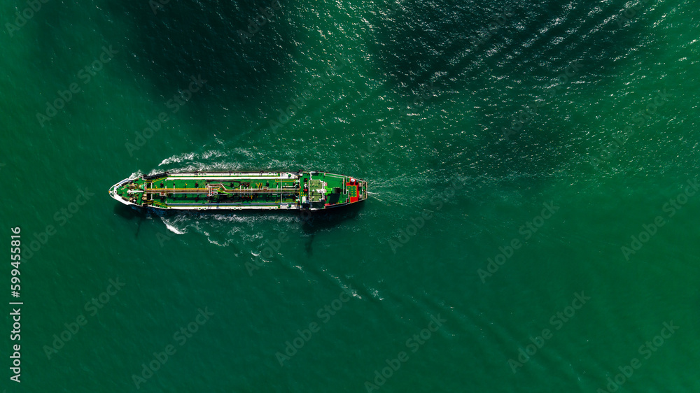 Aerial top view Oil ship tanker sailing full speed with beautiful wave ...