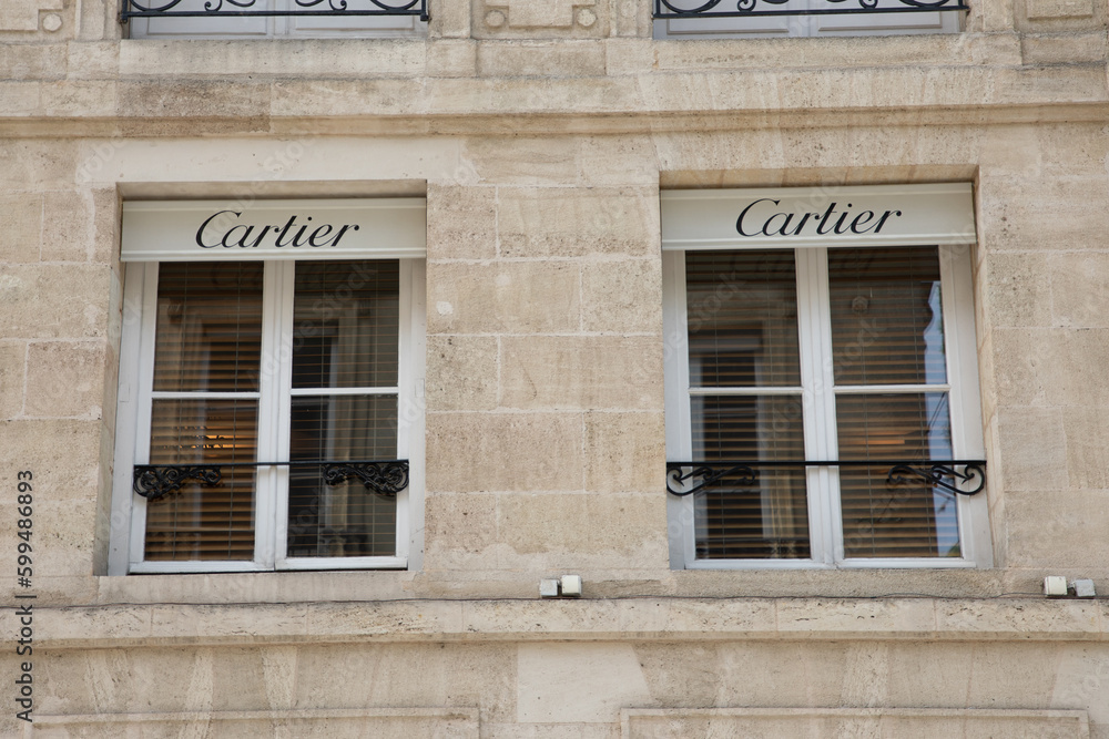 Cartier sign brand and text logo front wall entrance facade boutique ...