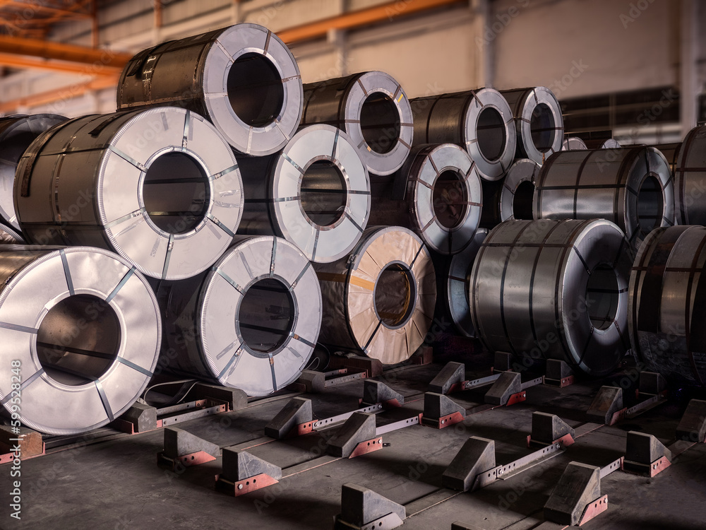 Steel coils are stacking at storage area in steel industry warehouse ...
