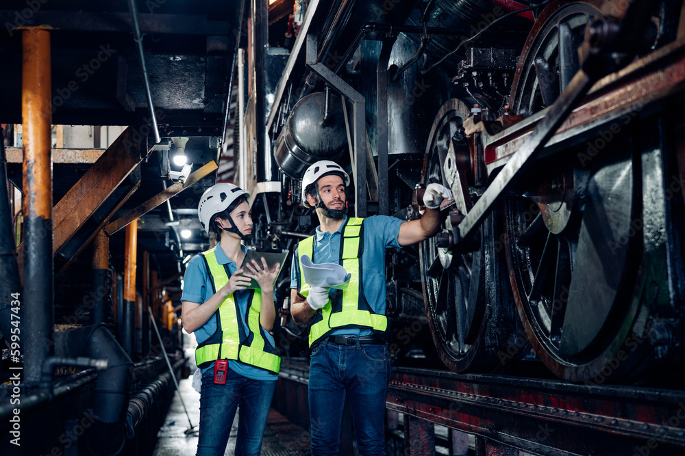 Team of engineer railway wearing safety uniform and helmet under ...
