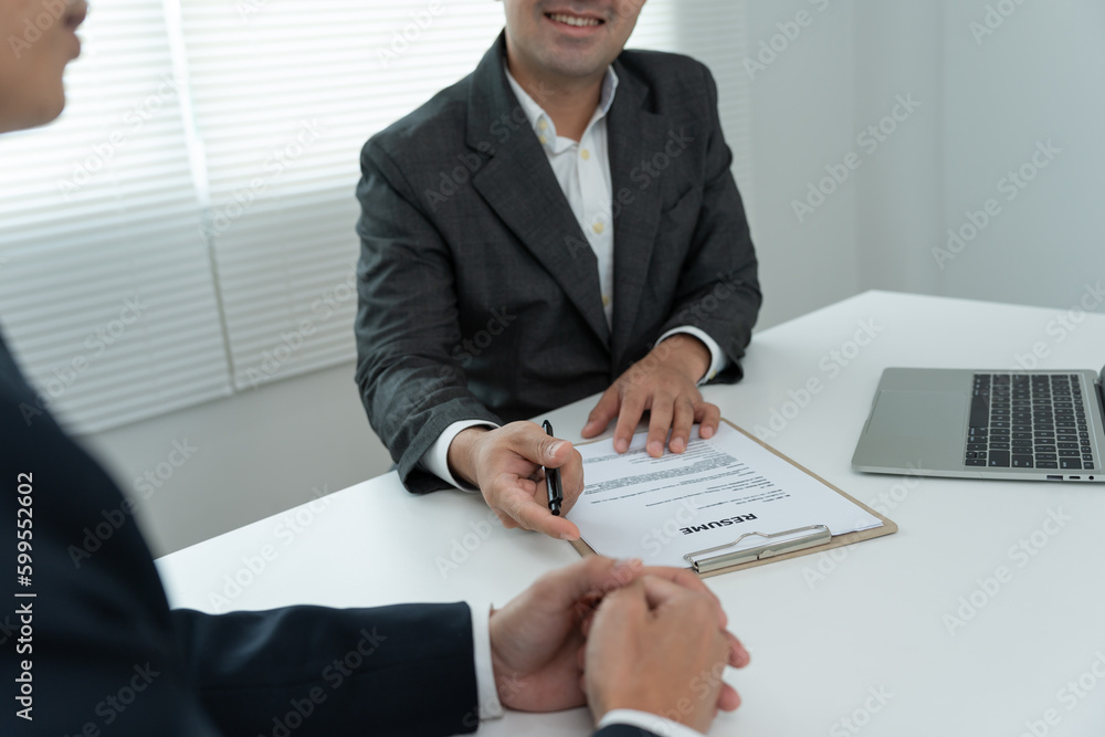 Executives accept job application documents and read job applicants ...