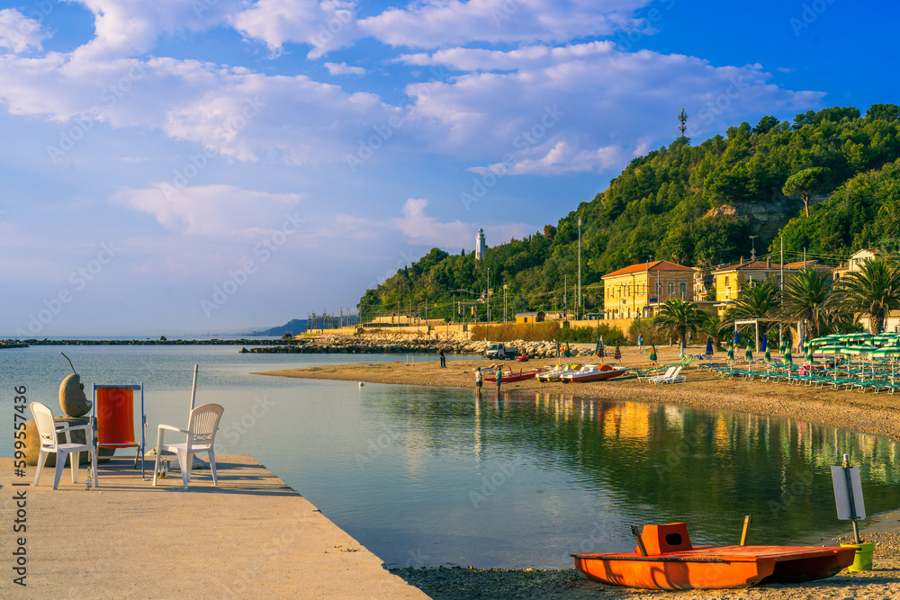 boat sitting on the beach at dawn, beautiful Italian beach scene ...