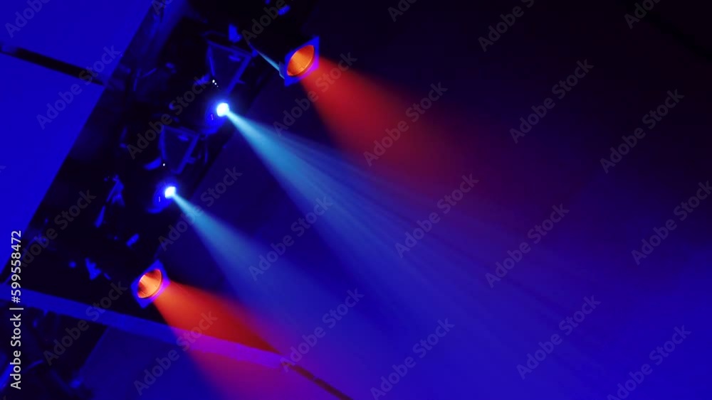 Stage lights with little smoke. Light rays from top to bottom. The ...