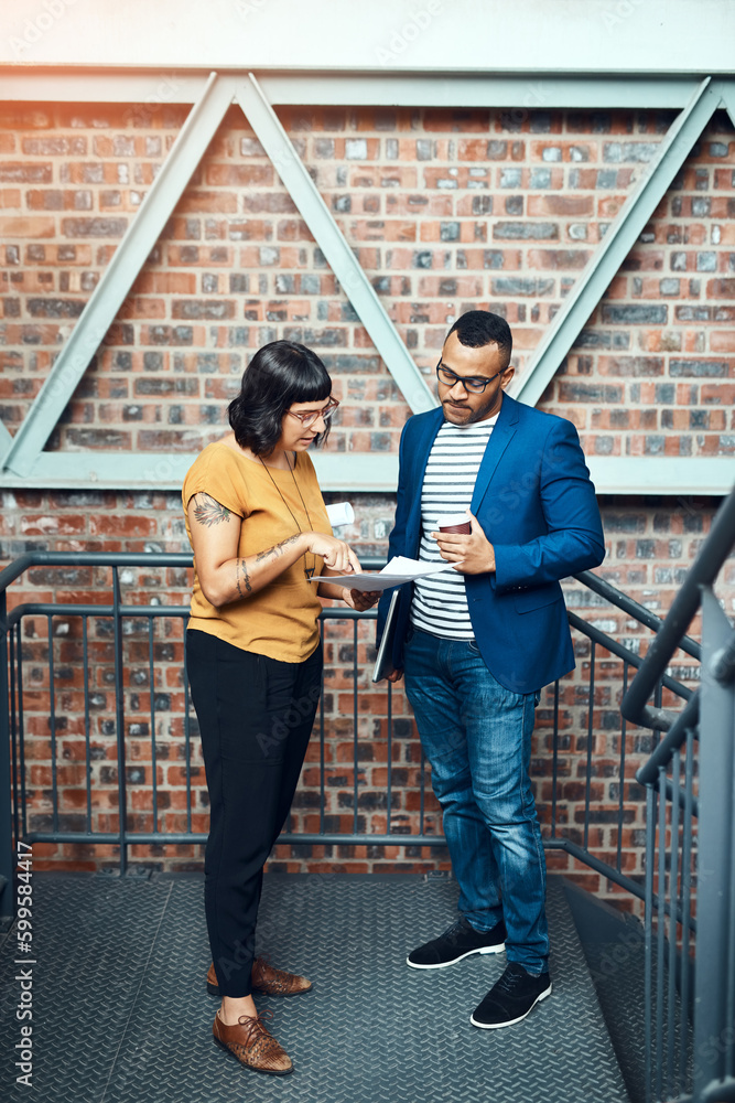 Reading up further on the brief. two designers having a discussion on a ...