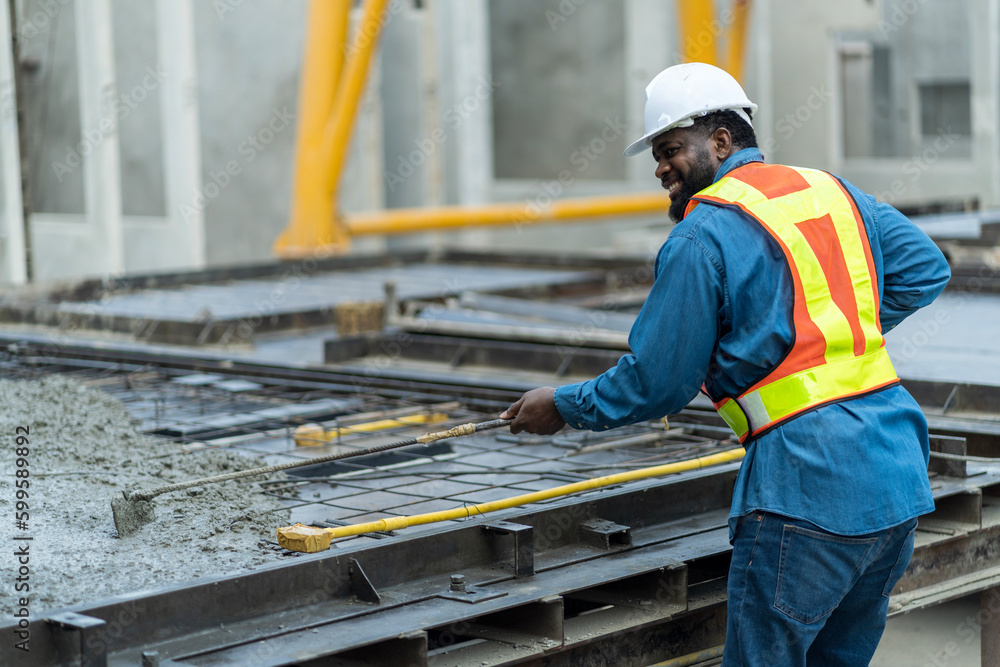 Male worker in a precast wall factory (Precast) is forming a wall with ...