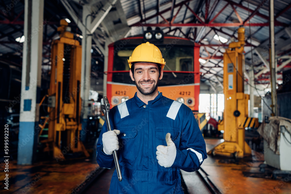 Engineer railway wearing safety uniform and helmet under checking under ...