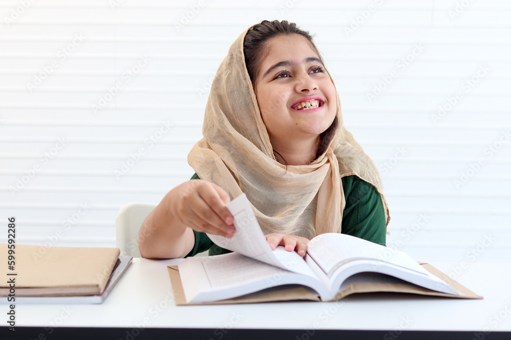 Happy Muslim student girl with beautiful eyes wears hijab traditional ...