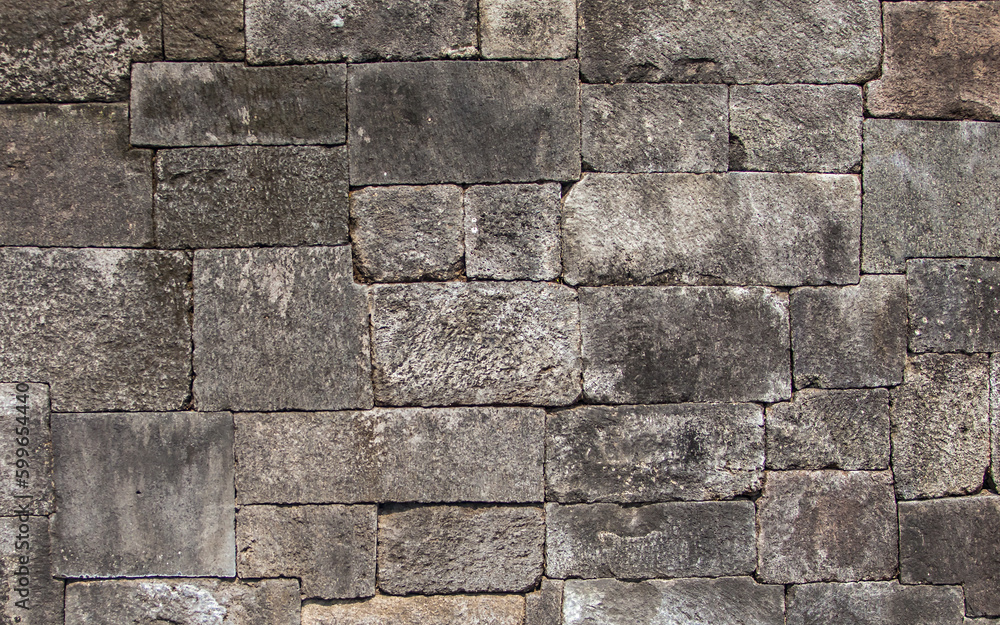 Ancient stone wall background and texture. These stone blocks were used ...