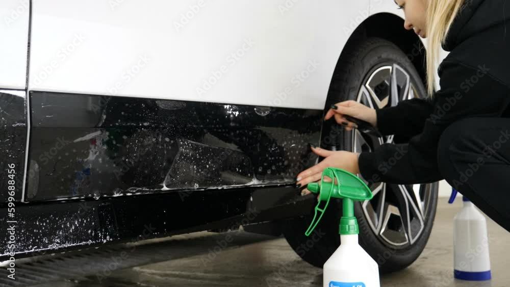 Close up to PPF installation process on a front headlight and hood. PPF ...