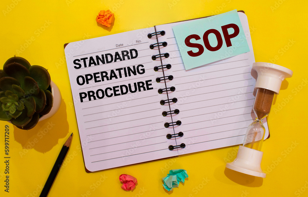 SOP - Standard Operating Procedure, text on notepad and office ...