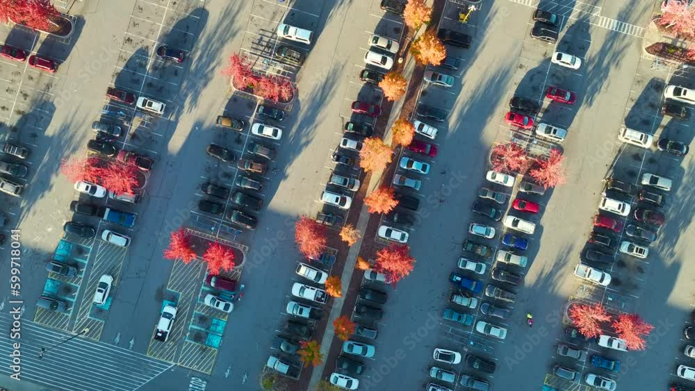 View from above of many parked cars on parking lot with lines and ...