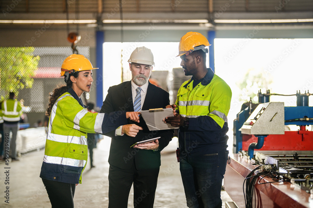 Senior boss manager talking staff engineer assistant woman and African ...