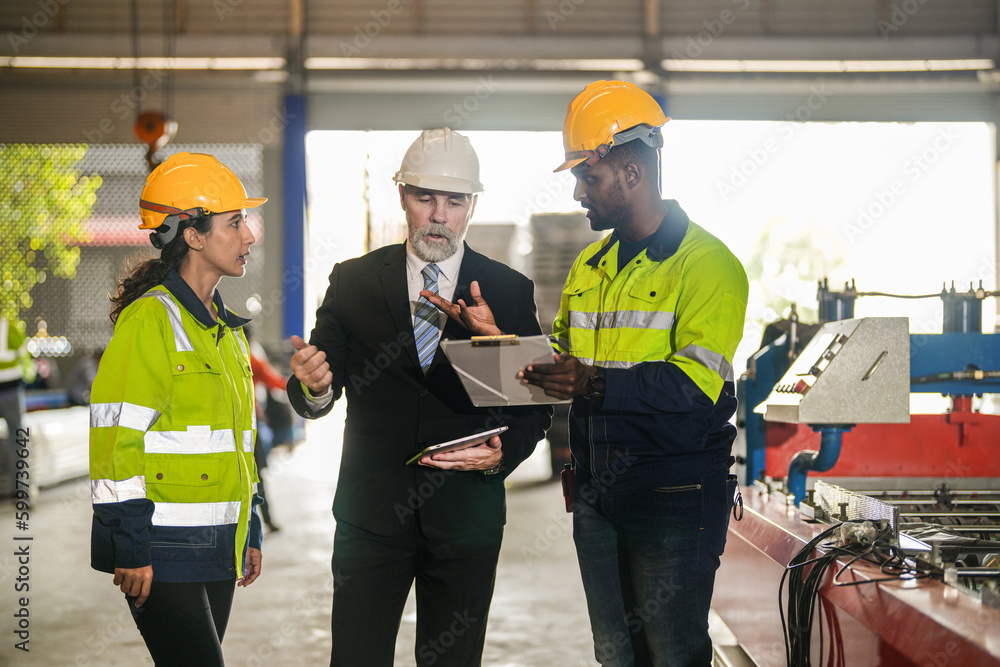 Senior boss manager talking staff engineer assistant woman and African ...