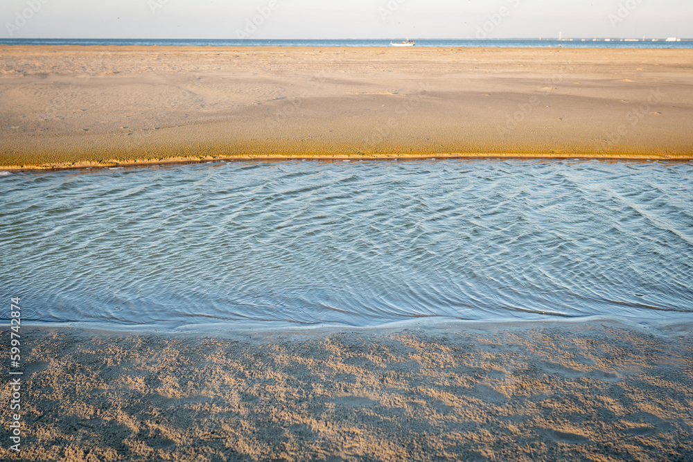 a small and isolated body of salty sea water trapped far from the waves ...