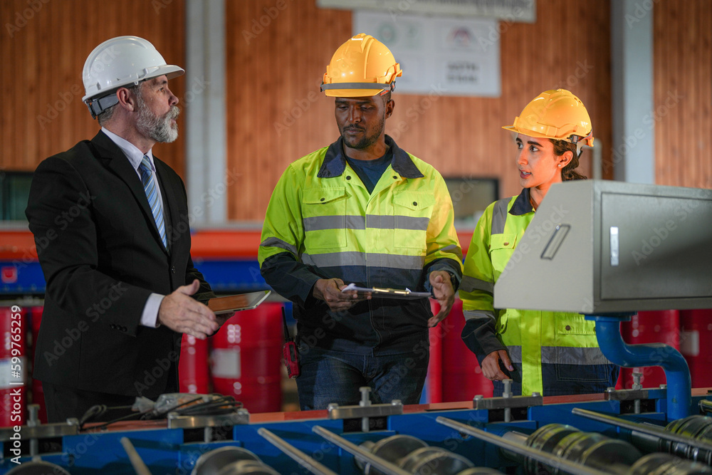 Senior boss manager talking staff engineer assistant woman and African ...