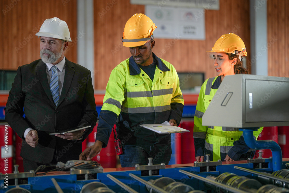 Senior boss manager talking staff engineer assistant woman and African ...