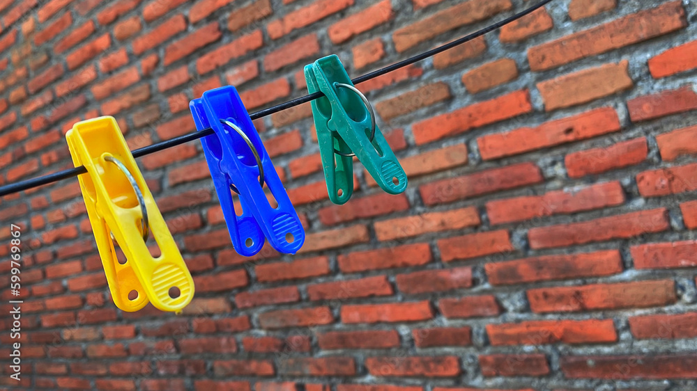 clothespins attached to stretched wire. clothespins attached to the ...