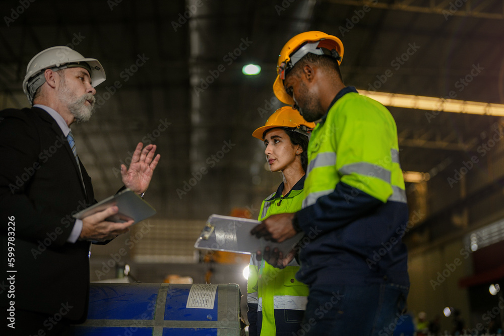 team of engineers checking control heavy machine in factory. Senior ...
