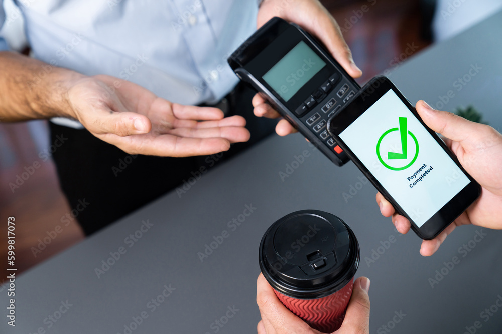 Hand holding smartphone with NFC QR code device, scanning contactless ...