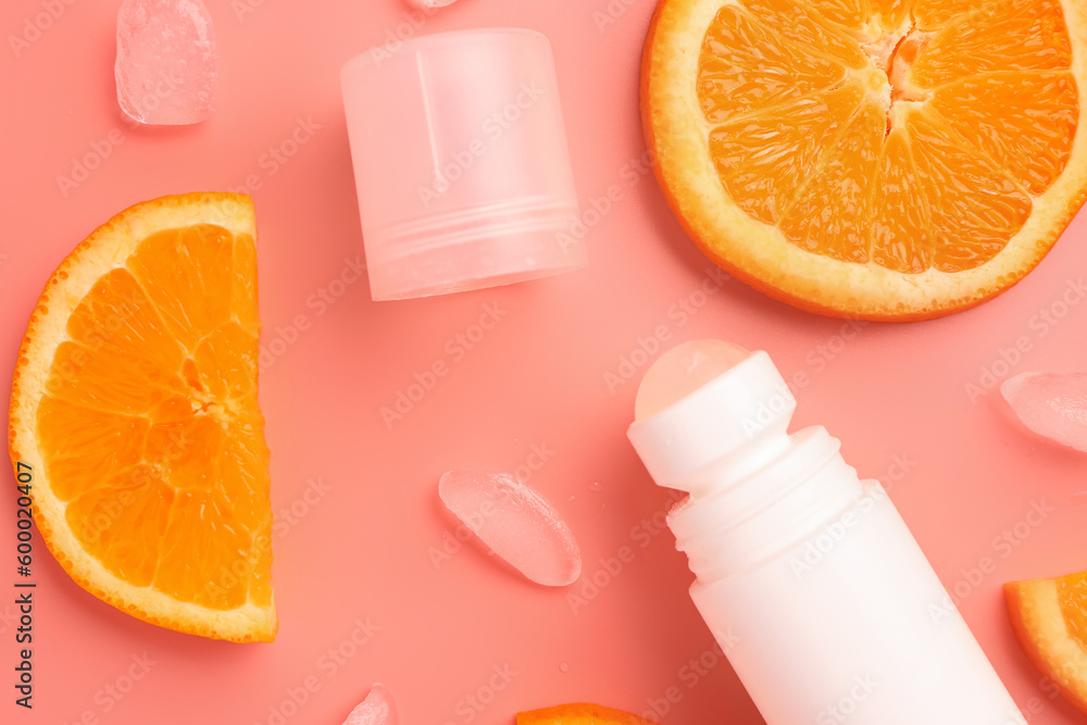 Open deodorant with orange slices and ice on color background Stock ...