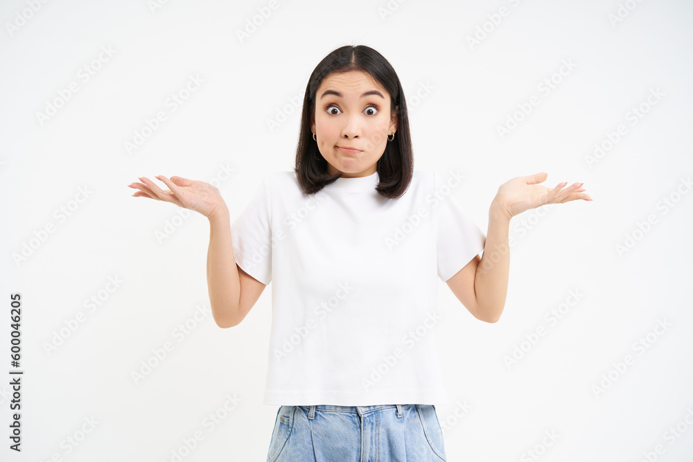 Clueless girl, asian woman shrugs shoulders, looks confused, doesnt ...