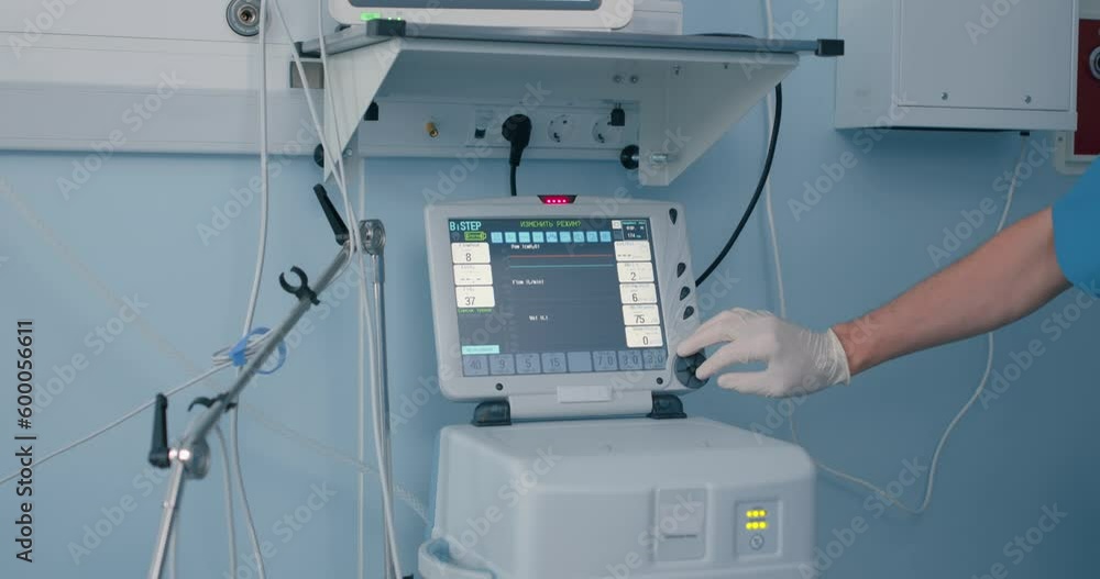 male nurse monitoring of patient in ICU Modern medical operation room ...