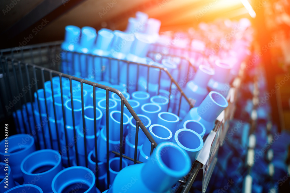 Water PVC pipes placed on the shelf in the building materials store ...