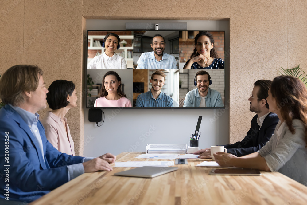 Young and ambitious multiethnic applicants on TV screen during group ...