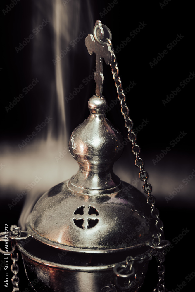 Liturgical golden censer with smoke on a dark background,with chains and coal Stock Photo ...