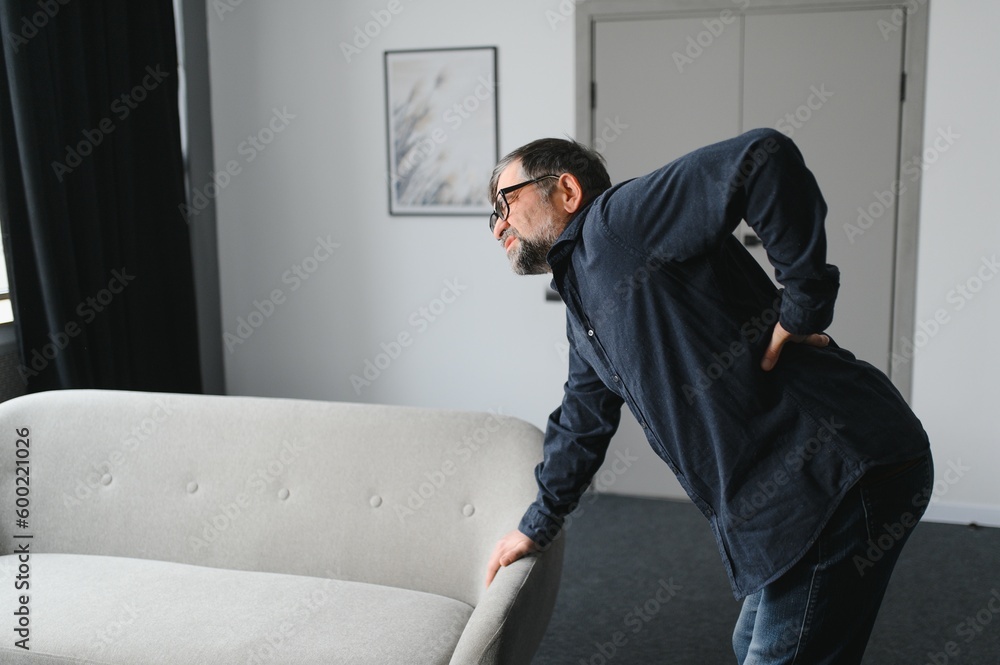 Senior man with back pain. Mature man suffering from low back pain. Old ...