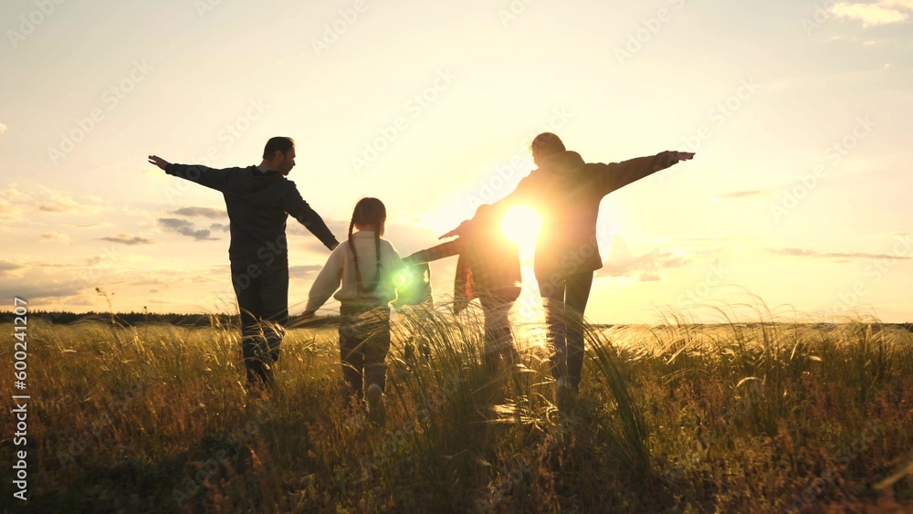 happy family. child father mother run sunset. girl boy parents ...
