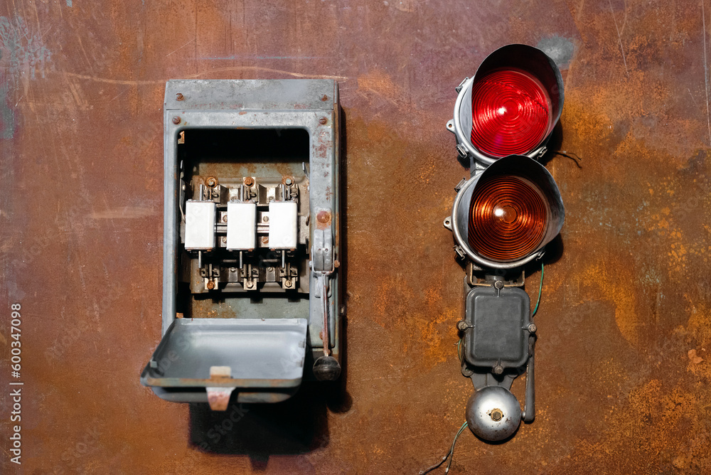 Old railroad traffic light and electric knife switch on the rusty metal ...