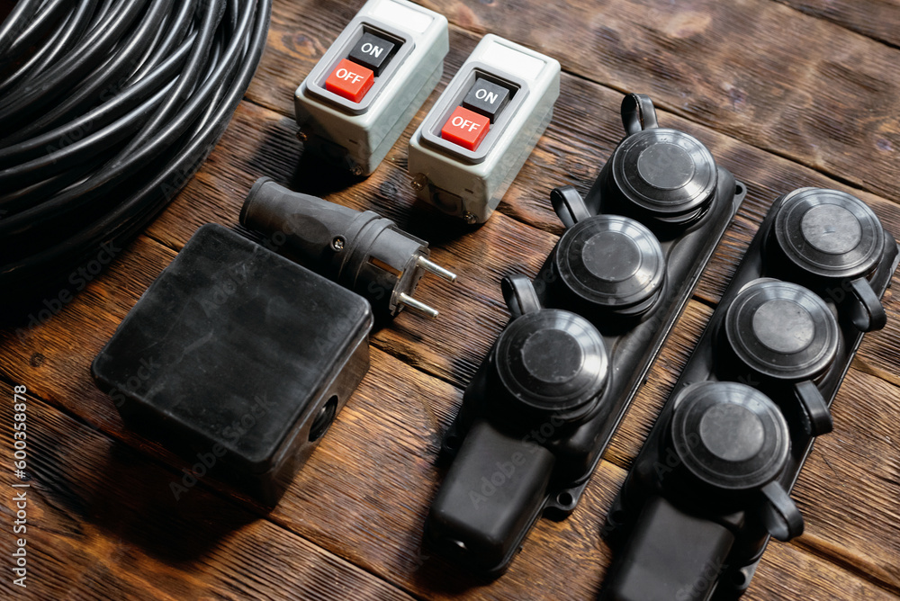 Electric works concept top view background. Electric cable, outlet and ...