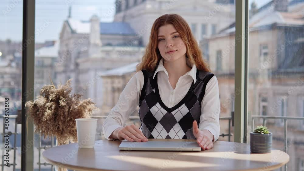 Pretty, successful, confident young businesswoman finish working on ...