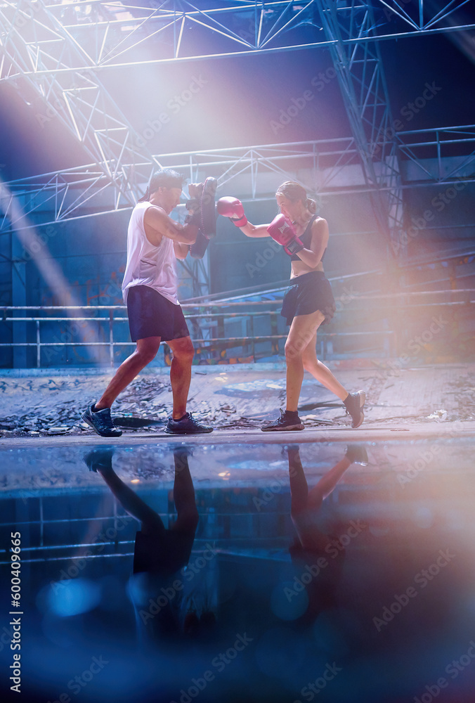 Female kickboxing training with male trainer gives self-defense classes ...