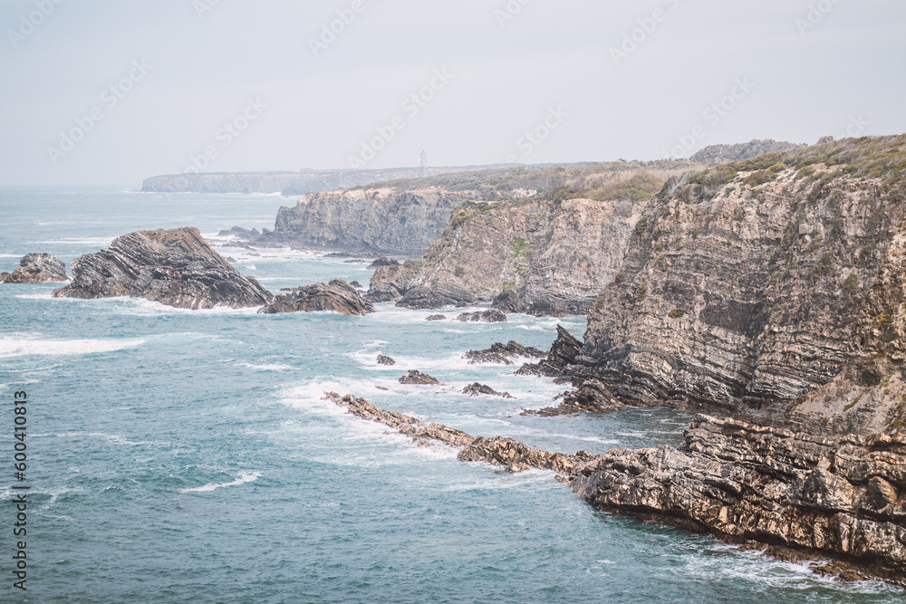 View of the rocky outcrops rising from the Atlantic Ocean in Zambujeira ...