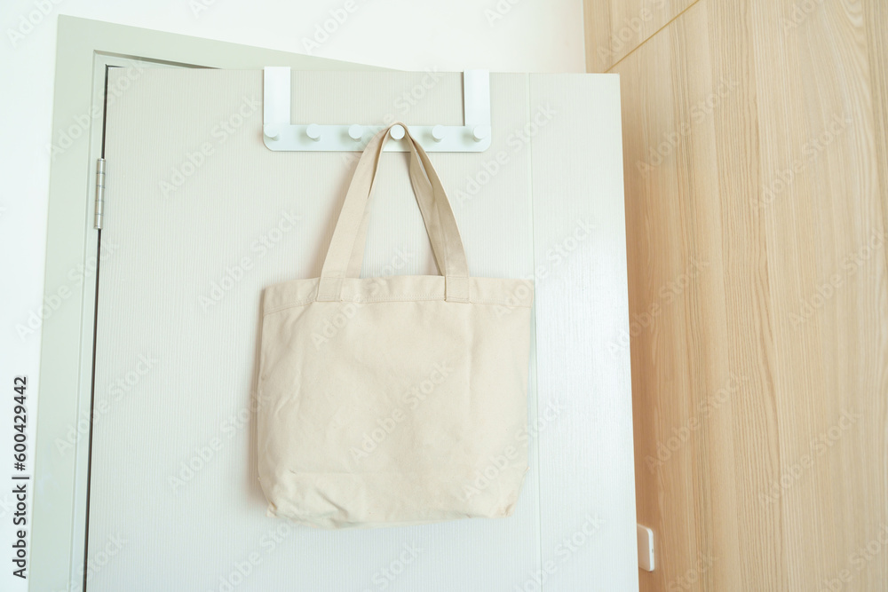 Eco friendly bag hanging on the door. Canvas Shopping tote bag. Zero ...