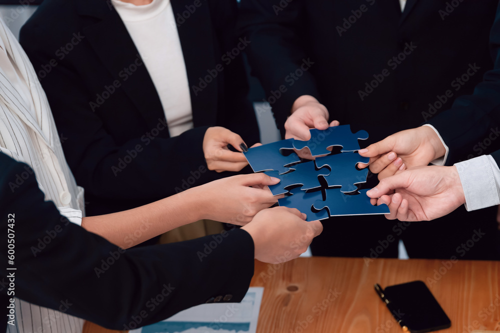 Closeup top view business team of office worker putting jigsaw puzzle ...
