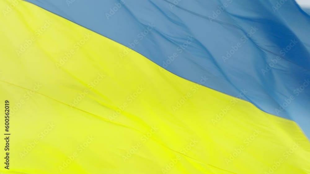 Close up macro view of fabric texture flag of Ukraine. Aerial zoom out ...