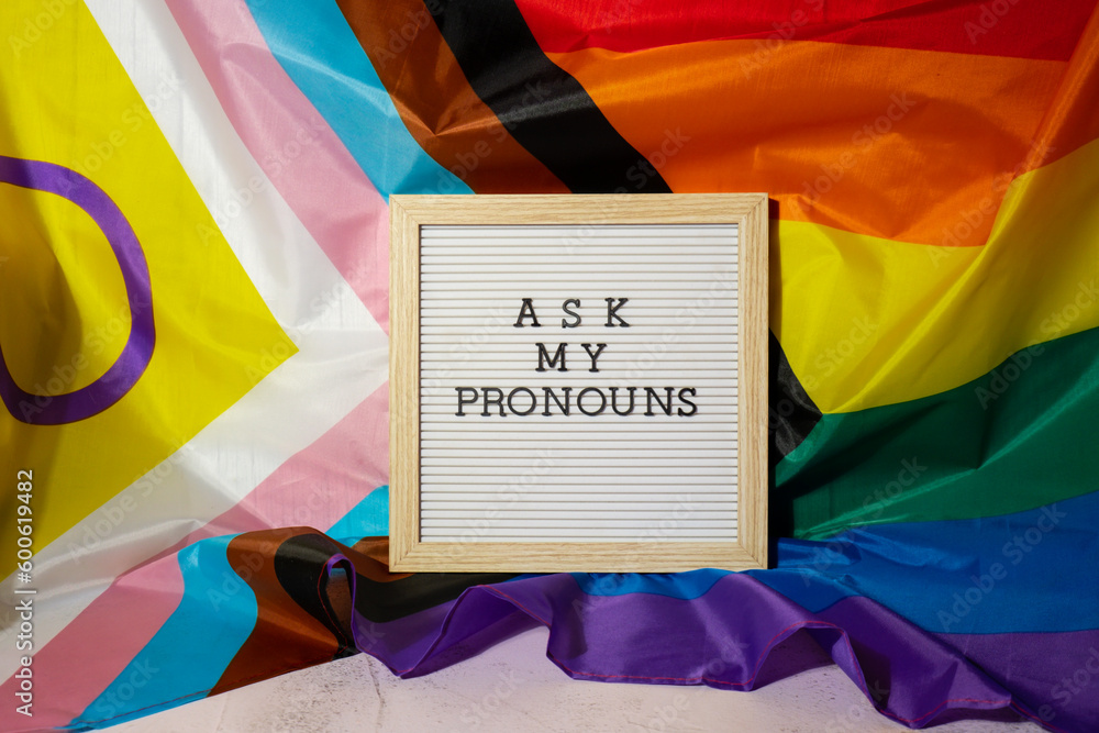 ASK MY PRONOUNS text Neo pronouns concept on Rainbow flag background ...