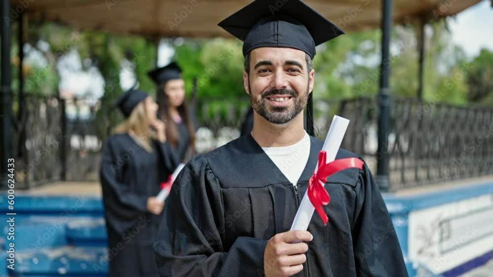 Group of people students graduated holding diploma at university campus ...