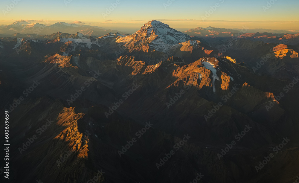 Aconcagua Peak from Andes Mountains at sunset. Aerial photo with the ...