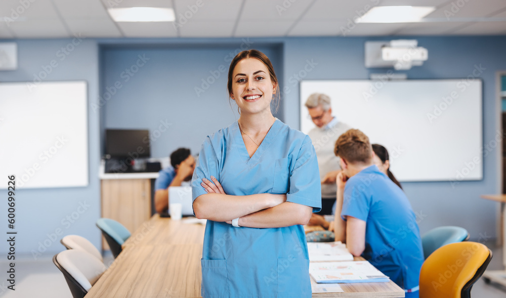 Portrait of a female medical student wearing scrubs in class Stock ...