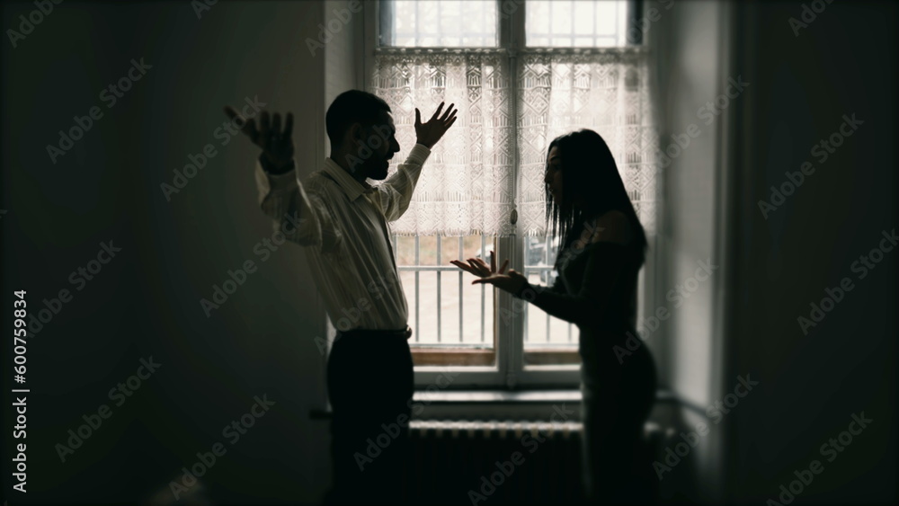 Silhouette of couple fighting each other, arguing and yelling at one ...