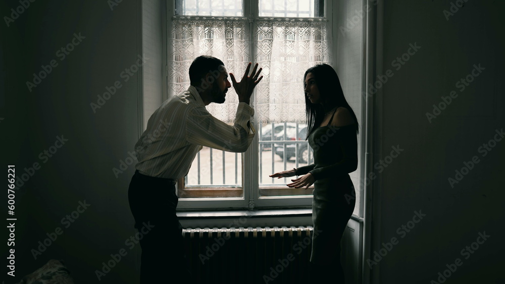 Angry man shouting at woman. Dramatic scene of couple yelling at each ...