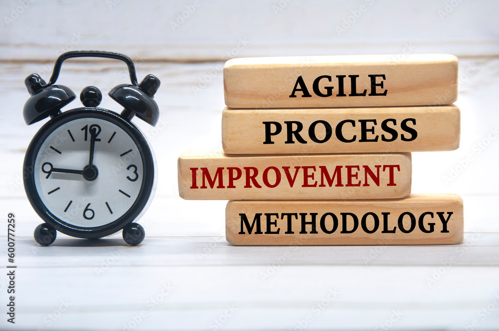 Agile process improvement methodology text on wooden background with ...